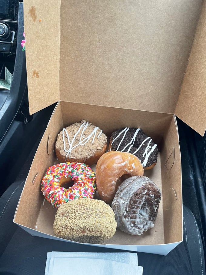Car dashboard donut picnics: a New Hampshire tradition since the invention of cup holders. The sprinkled one's calling your name.