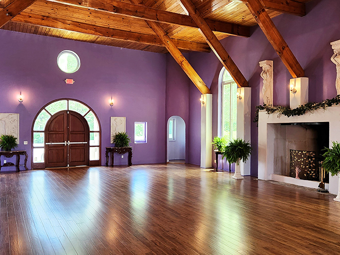 This grand hall with its soaring wooden beams and lavender walls could host anything from medieval feasts to modern wedding receptions. Camelot meets comfort.