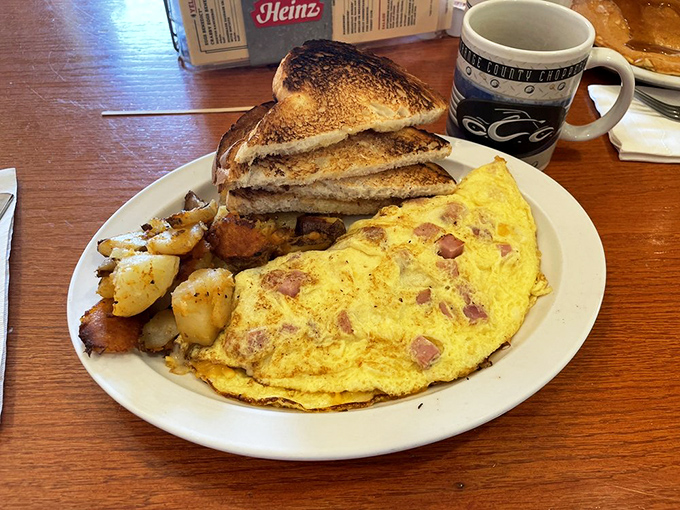 Eggs Benedict that means business. Those perfectly poached eggs draped in hollandaise are the breakfast equivalent of a warm hug.
