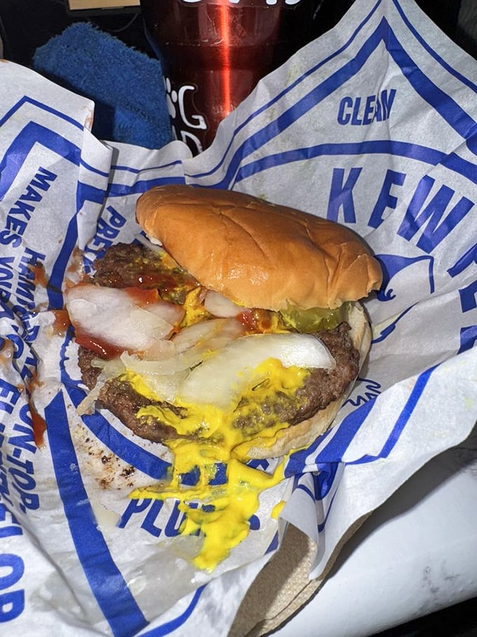 This isn't just a hamburger; it's edible nostalgia wrapped in wax paper, where mustard and pickle create a symphony that's been perfected over generations.