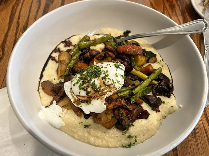 Grits elevated to an art form, crowned with roasted vegetables and that perfectly poached egg. Southern comfort food that went to culinary school.