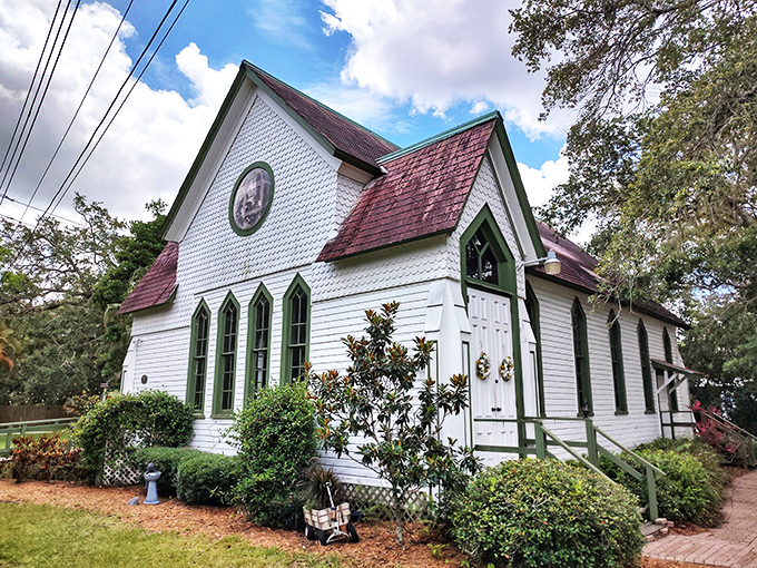 This historic chapel stands as a serene reminder of Dunedin's past, its Gothic windows and red roof creating a postcard-perfect scene among Florida's palms.