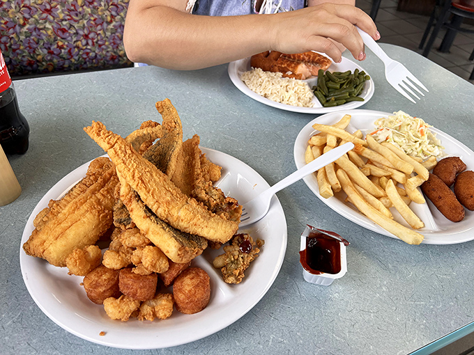 Golden-fried seafood mountains that make you want to plant a tiny flag on top and claim them for your stomach.