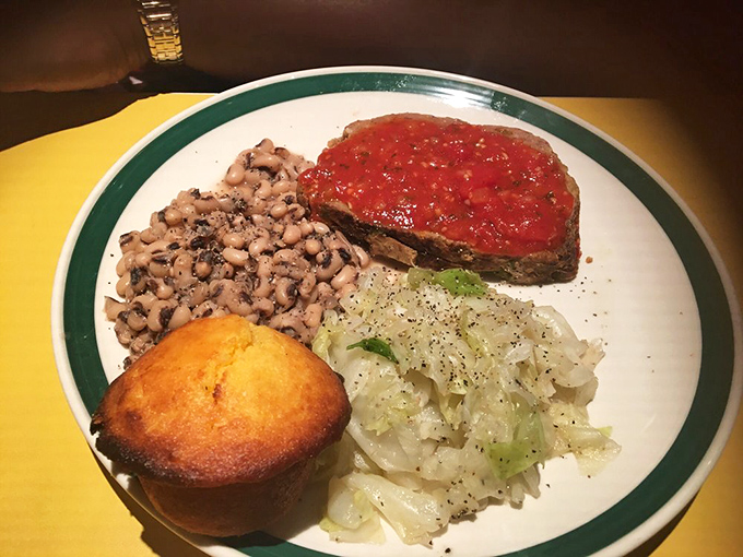 That famous meatloaf, crowned with tangy tomato sauce, sits alongside black-eyed peas and cabbage &ndash; a Southern trinity of comfort.