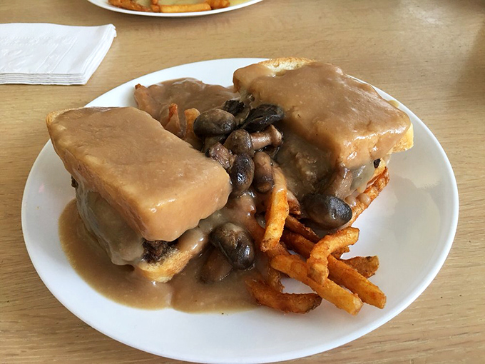 Behold the holy trinity of comfort: hot turkey, mushroom gravy, and those perfectly crispy sweet potato fries. Thanksgiving without the family drama.