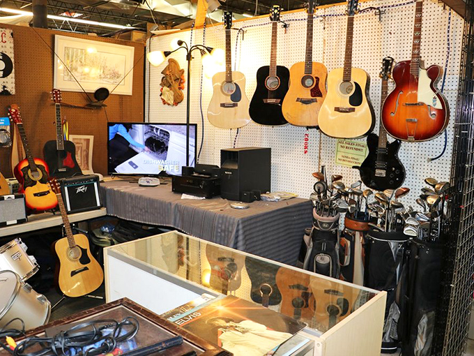 Guitar heaven meets golf paradise. One booth solving both your musical aspirations and your putting problems simultaneously.