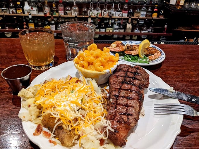 A perfectly grilled NY Strip lounges on the plate like it owns the place, flanked by steamed veggies that know they're just along for the ride. 
