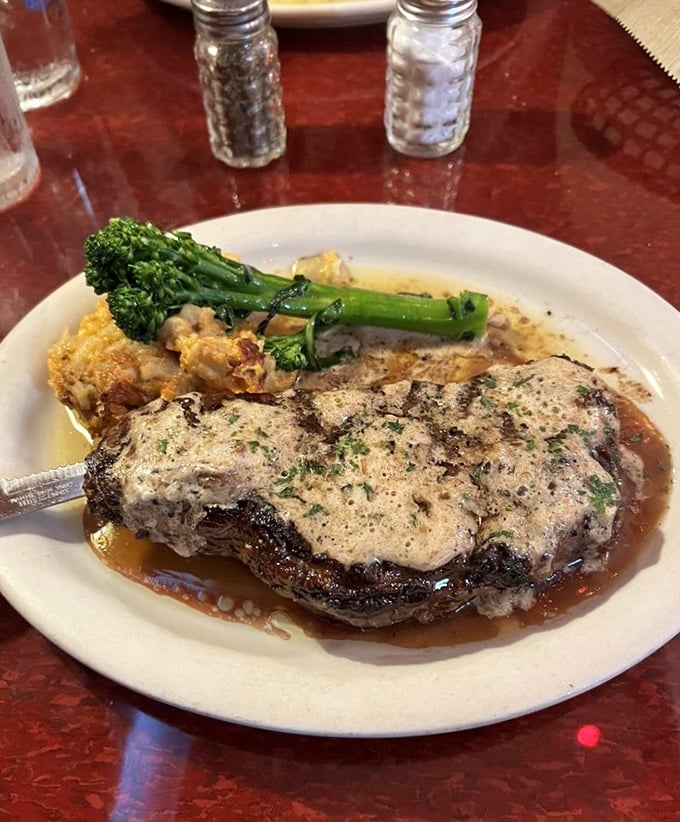 This isn't just a steak&mdash;it's a masterclass in the art of beef. The creamy sauce and perfectly cooked broccolini prove sides aren't afterthoughts here.