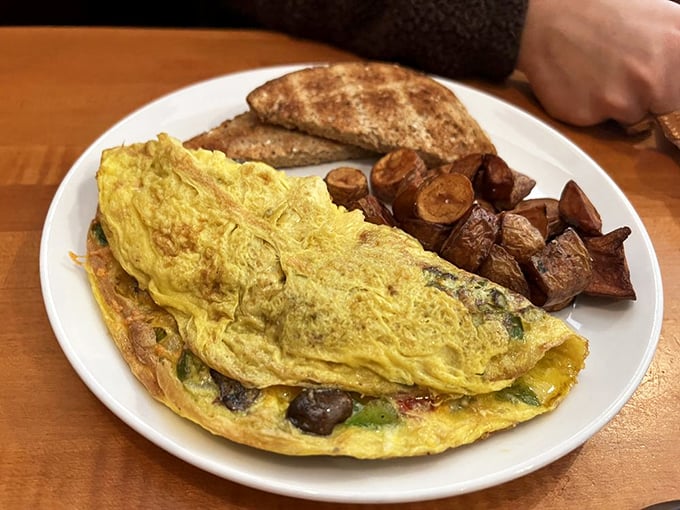 This isn't just an omelet; it's a fluffy golden envelope delivering a love letter from local farms straight to your taste buds.