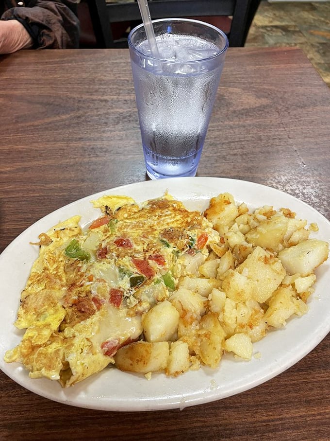 This veggie omelet doesn't just whisper "good morning"&mdash;it belts out a full Broadway number. Those home fries deserve their own standing ovation.