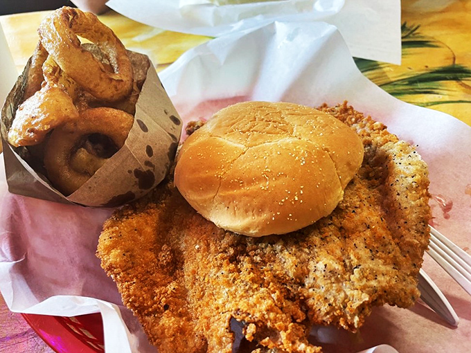 Holy schnitzels, Batman! This pork tenderloin is so big, it's trying to escape the bun. Bring your appetite and maybe a friend or two.