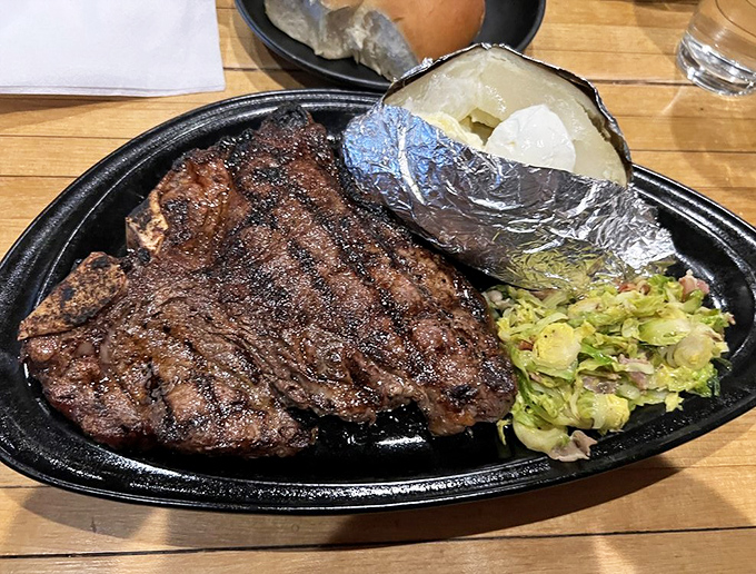 This porterhouse doesn't just sit on the plate&mdash;it commands it. Perfectly charred exterior, pink interior, and a baked potato standing by for backup.