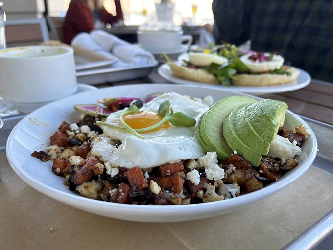 This isn't just breakfast&mdash;it's a morning masterpiece where perfectly poached eggs meet roasted potatoes and avocado in a harmony that makes hitting the snooze button seem criminal.