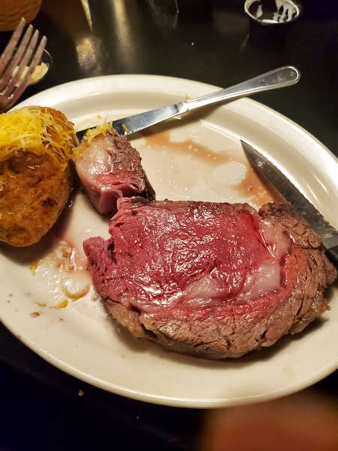 Behold the crown jewel: prime rib so perfectly pink it makes vegetarians reconsider their life choices. That loaded potato isn't just a side&mdash;it's a wingman.