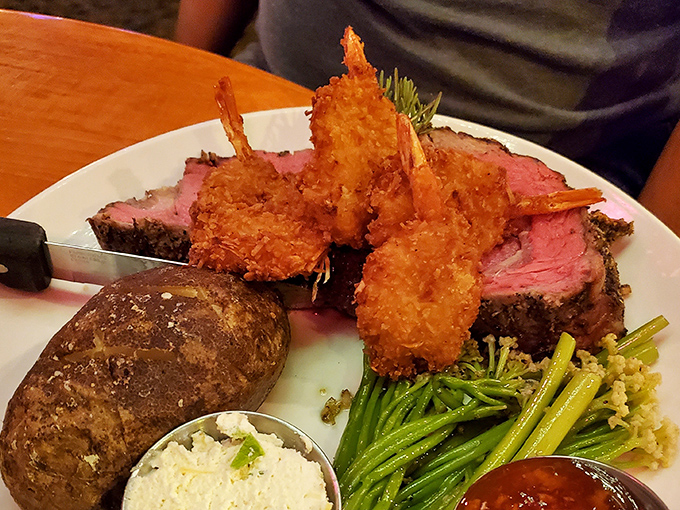 Prime rib and coconut prawns sharing a plate like old friends at a reunion. That golden-brown breading is what dreams are made of.
