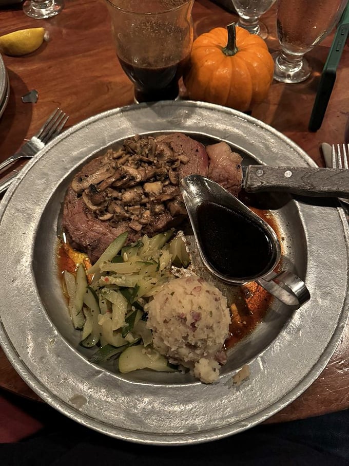 Prime rib perfection! Tender meat, savory mushrooms, and that boat of au jus &ndash; this plate isn't just dinner, it's a religious experience with mashed potatoes.