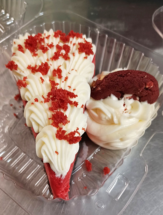 Red velvet cheesecake that's dressed more elegantly than most people at formal weddings, complete with a chocolate cookie bowtie.