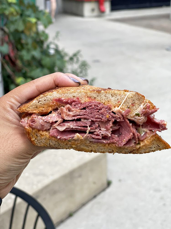 This isn't just a sandwich&mdash;it's a monument to meat architecture. The corned beef practically winks at you between toasty rye slices.
