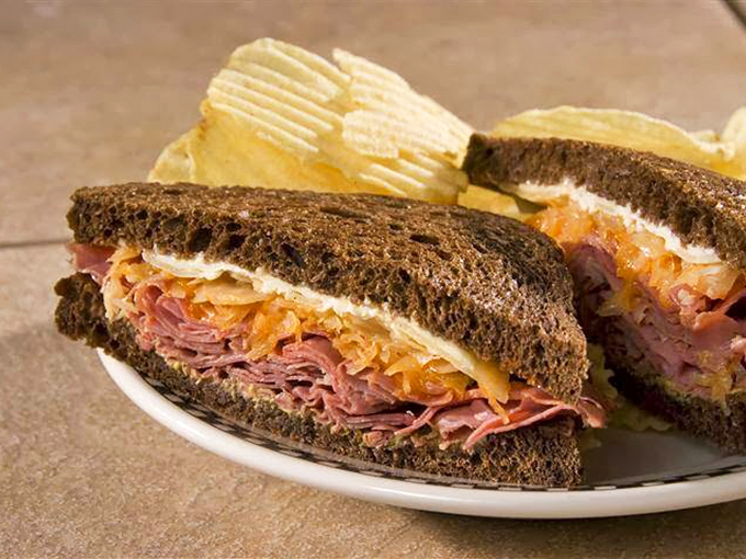 Behold the Reuben in all its glory&mdash;layers of corned beef, sauerkraut, and Swiss cheese creating what might be the most perfect bite in Alabama.