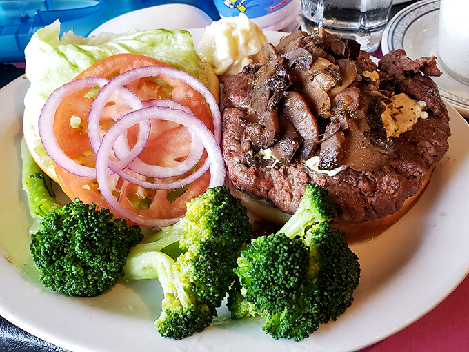 A perfectly seared steak topped with saut&eacute;ed mushrooms, accompanied by fresh vegetables&mdash;proof that sometimes the classics never need reinvention.