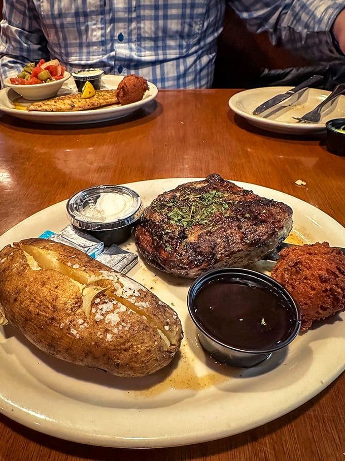 Steak night done right. That perfect char, a loaded baked potato, and a hush puppy that didn't stand a chance &ndash; this is Florida's answer to steakhouse royalty.