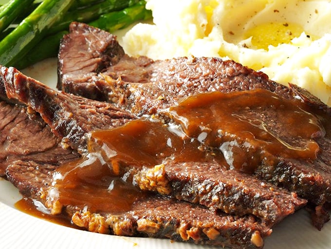 Slices of roast beef so tender they practically surrender to your fork. That smoke ring is the BBQ equivalent of a Michelin star.
