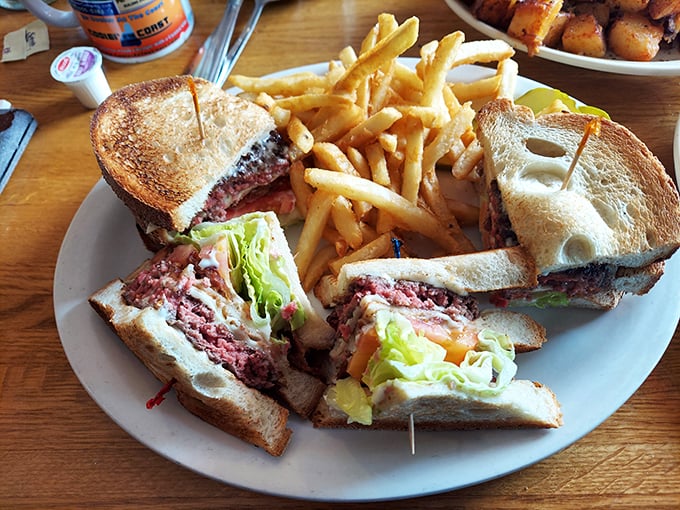 The club sandwich at Linda's arrives like a skyscraper of flavor, proving that architectural genius sometimes comes between two slices of perfectly toasted bread.