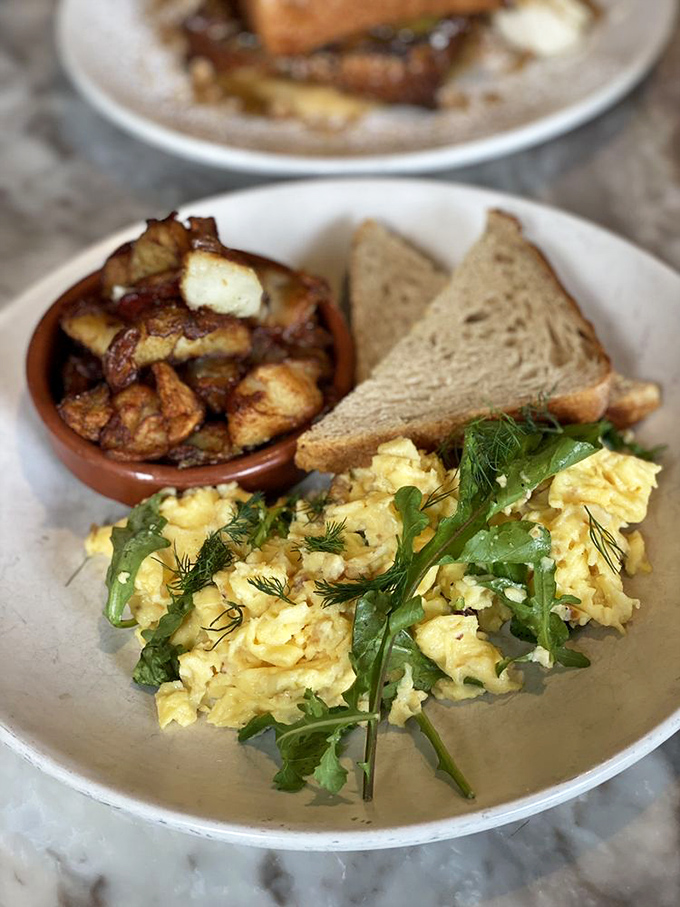 Scrambled eggs elevated to an art form, with fresh herbs and perfectly crispy potatoes. Breakfast doesn't get the Emmy, but this plate deserves one.