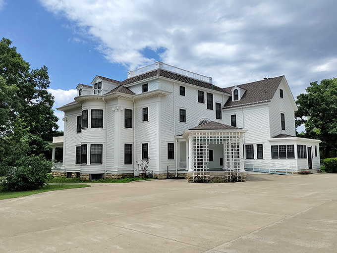 The Seelye Mansion stands pristine in white, like a wedding cake you can actually walk through. Dr. Seelye's patent medicine fortune built it; your camera roll will thank you.