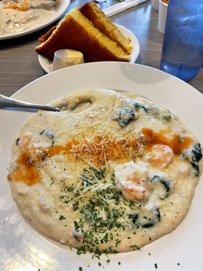 Behold the legendary shrimp and grits in all their creamy, savory glory. This bowl of Southern sunshine is worth crossing county lines for.