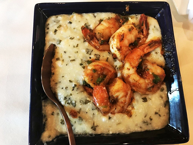 The legendary shrimp and grits that launch road trips. Those plump crustaceans lounging on creamy grits look like they're on vacation too.