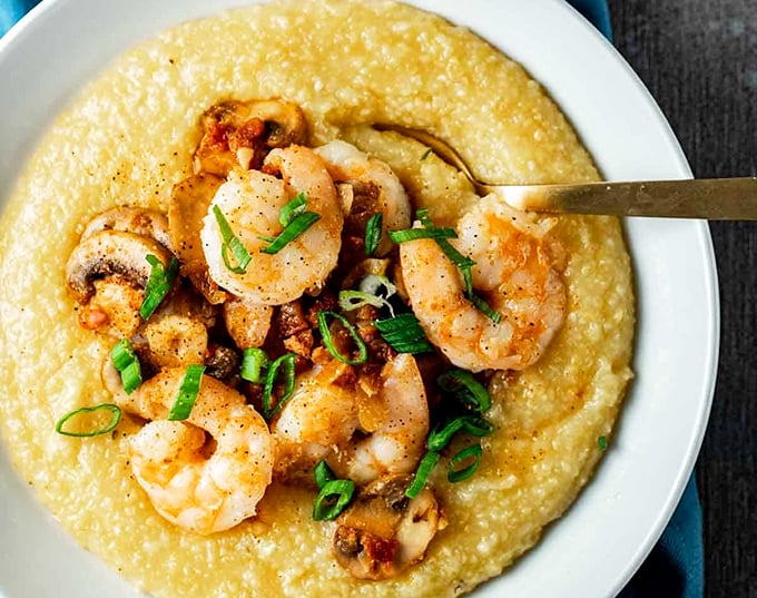 Behold the crown jewel! These shrimp and grits aren't just a dish, they're a religious experience worthy of a pilgrimage across state lines.
