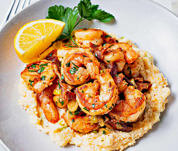 These shrimp and grits aren't just a meal; they're the reason alarm clocks were invented. Worth waking up for, even on your day off.