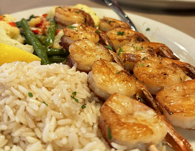 These perfectly seared shrimp look like they're auditioning for a seafood calendar&mdash;plump, glistening, and ready for their close-up alongside fluffy rice.