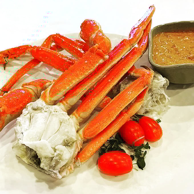 Snow crab legs arranged like nature's sculpture&mdash;a crustacean masterpiece that requires only your hands and appetite as artistic tools.