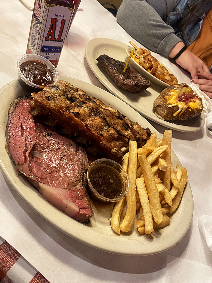 This isn't just dinner&mdash;it's a primal experience. The prime rib and ribs share a plate like old friends, while those golden fries stand by like loyal sidekicks.