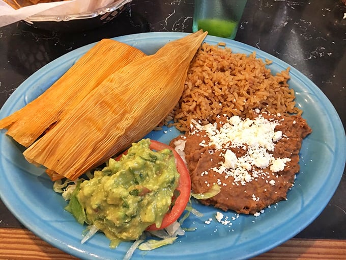 Tamales that deserve their own ZIP code&mdash;corn husks cradling perfectly seasoned masa and fillings, served with rice, beans, and guacamole that makes store-bought versions weep with inadequacy.