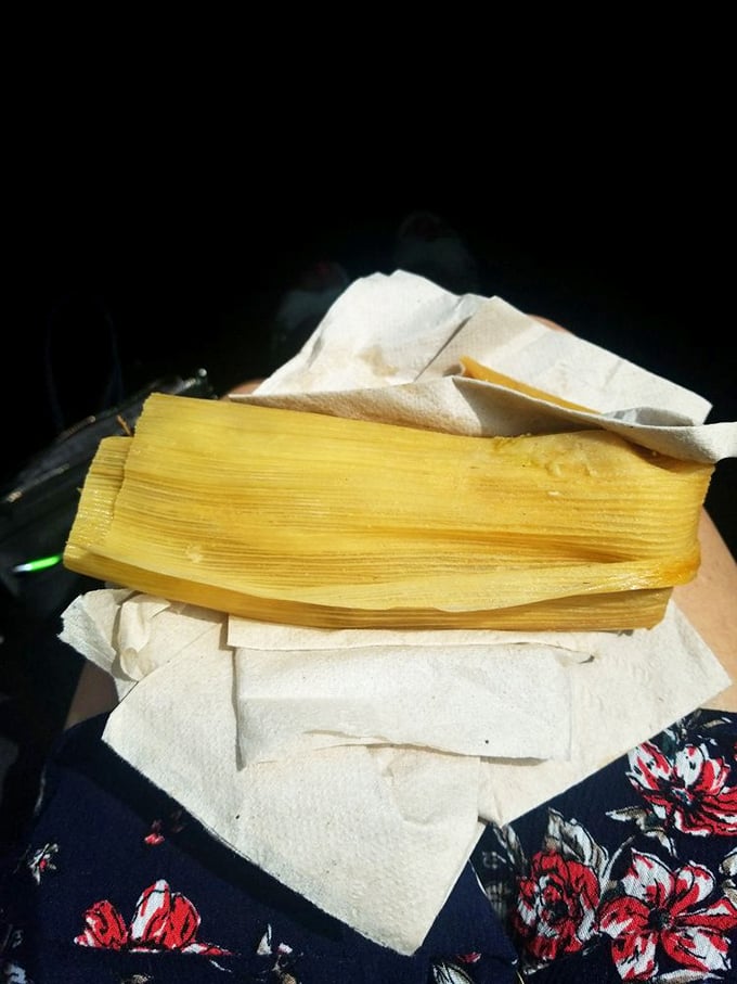 Behold the star attraction: a perfect tamale, still nestled in its corn husk wrapper like a sleeping baby in a blanket.