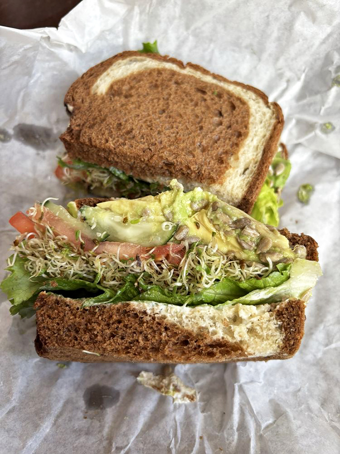 The tuna melt that launched a thousand road trips. Golden-toasted bread, perfectly melted cheese, and a pickle that means business.