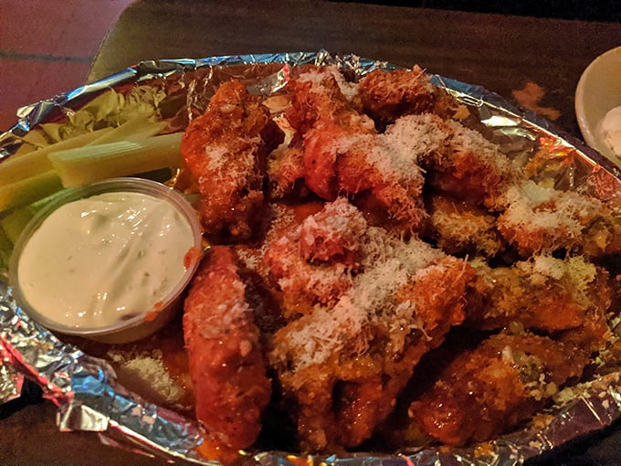 These aren't just wings; they're the reason people who "don't go to dive bars" suddenly become regulars. The Garlic Parm might change your life philosophy.