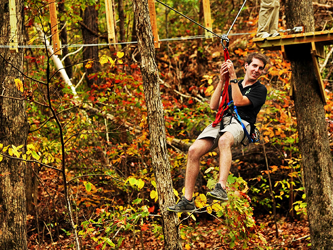 Adventure awaits above the forest floor! Ziplining through autumn-painted Ozark trees offers thrills that would make even squirrels jealous.
