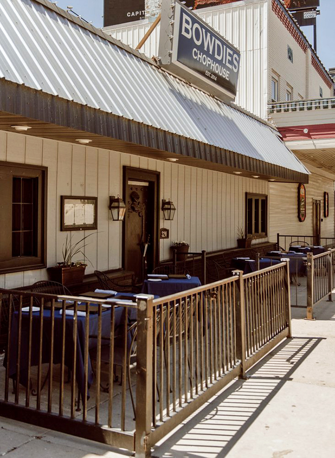Bowdie's outdoor seating area &ndash; where summer evenings and sizzling steaks create memories that outlast Michigan winters.
