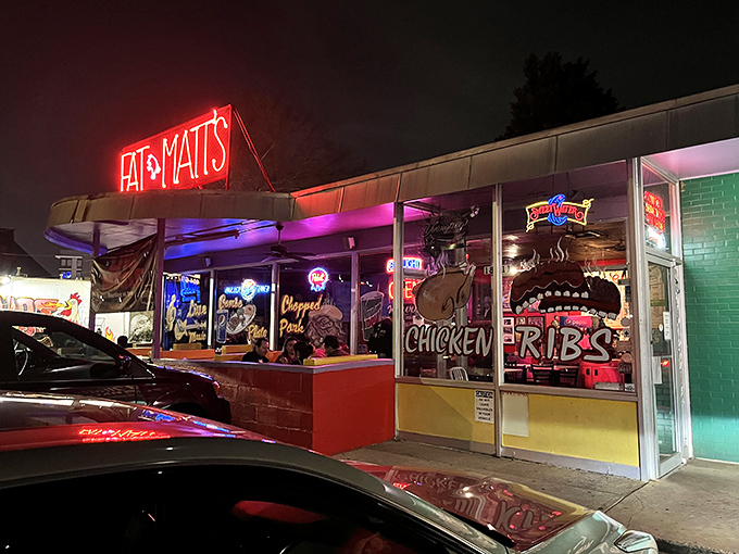 Fat Matt's neon glow cuts through Atlanta nights like a barbecue beacon calling hungry souls home.