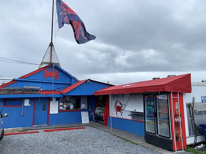 That vibrant blue building with a proud crab flag stands like a beacon to seafood lovers. Color me hungry just looking at it!