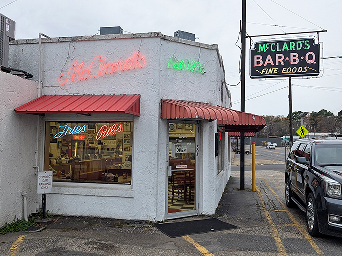 McClard's BBQ: "White walls, red awnings, neon promise. McClard's doesn't just serve barbecue &ndash; it serves Arkansas history on butcher paper."