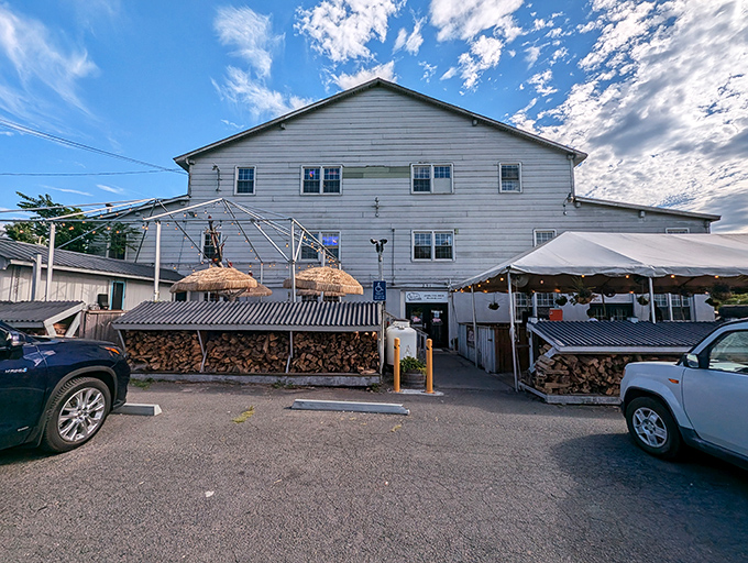 Monk's BBQ doesn't hide its secret weapon &ndash; just look at those woodpiles! Like a squirrel preparing for winter, they're stocking up on smoky flavor.