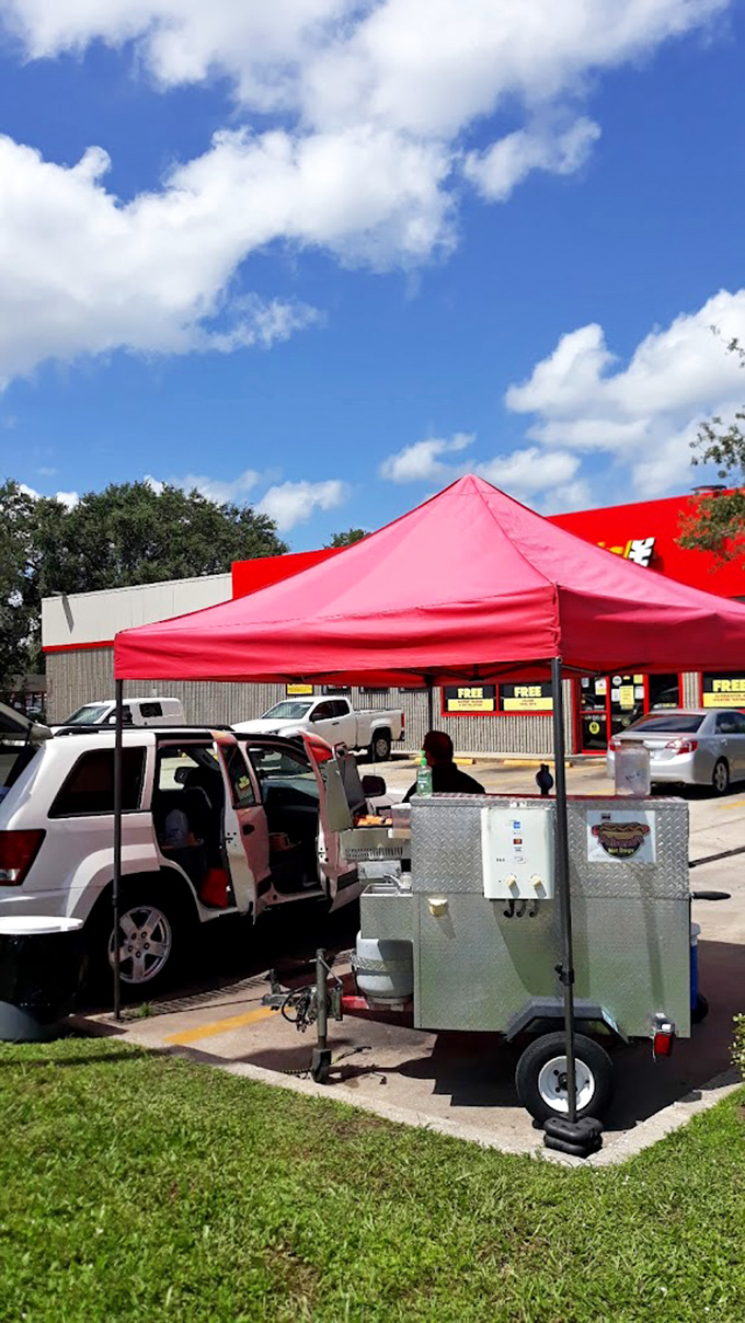 Paisano's vibrant red tent creates an impromptu fiesta atmosphere &ndash; a Colombian hot dog carnival in the middle of an Orlando parking lot.