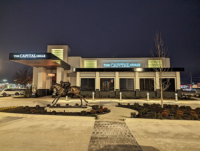 The Capital Grille (night view): "When the sun sets, this Louisville steakhouse lights up like a beef-lover's beacon. Even the horse statue looks hungry."