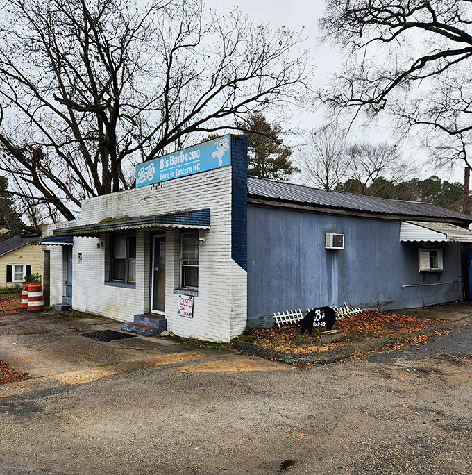 This unassuming spot looks closed until you spot the smoke signals and the line of BBQ pilgrims waiting for divine pork.
