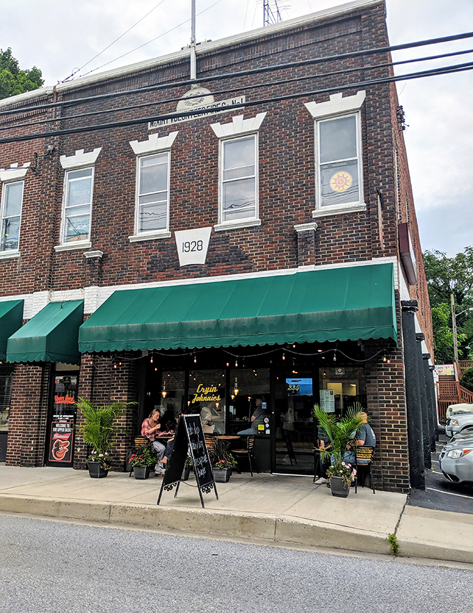 The charming exterior of Cryin' Johnnies promises the kind of authentic local experience that travel shows desperately try to discover first.